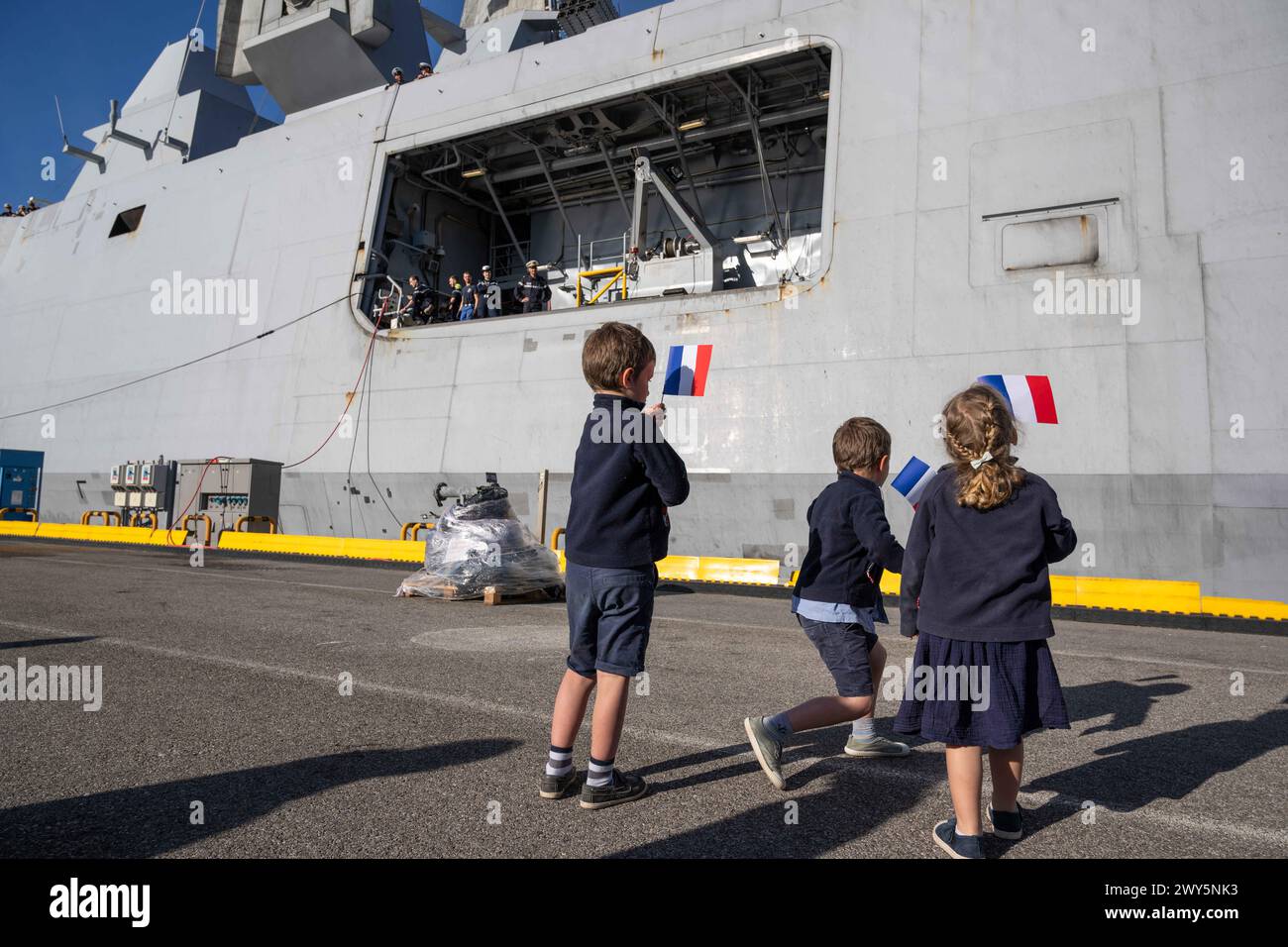 Children wait for their sailor father aboard the multi-mission frigate ...
