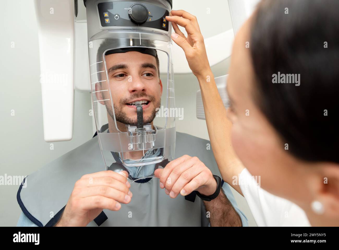 Professional dentist using special equipment and making panoramic ...