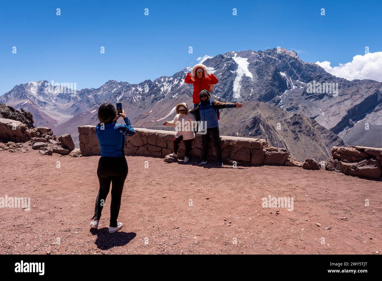 Tourists Pose For Photos On The Argentine Side Of The Andes Mountains ...