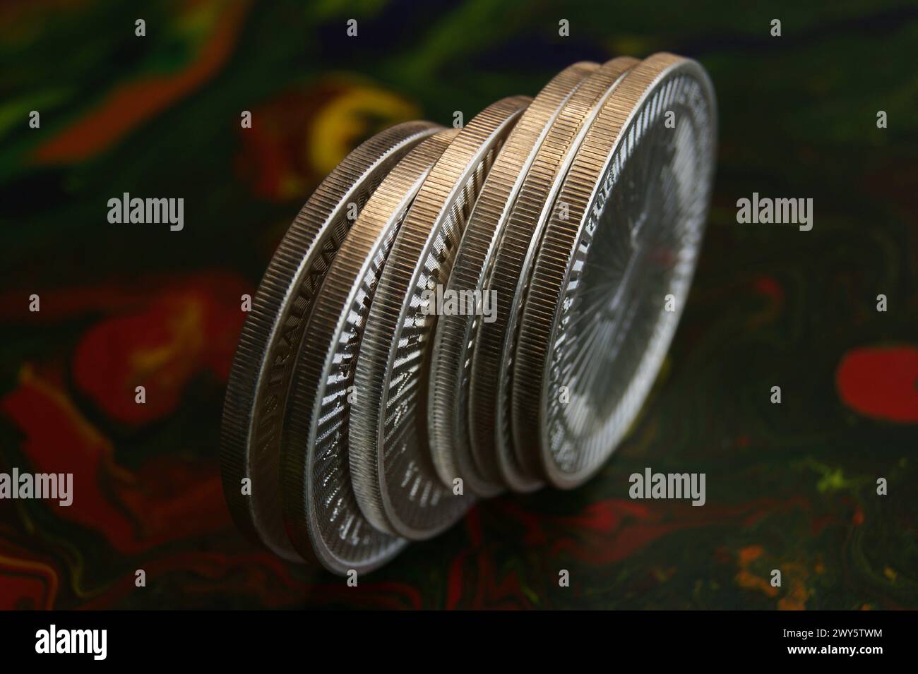 Edges of pure silver coins. Coins stand on edge. Coins stand on edge ...