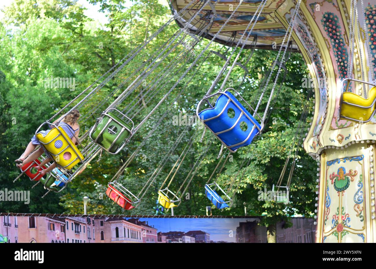 The moment was filmed when the carousel cradles on chains sweep past ...