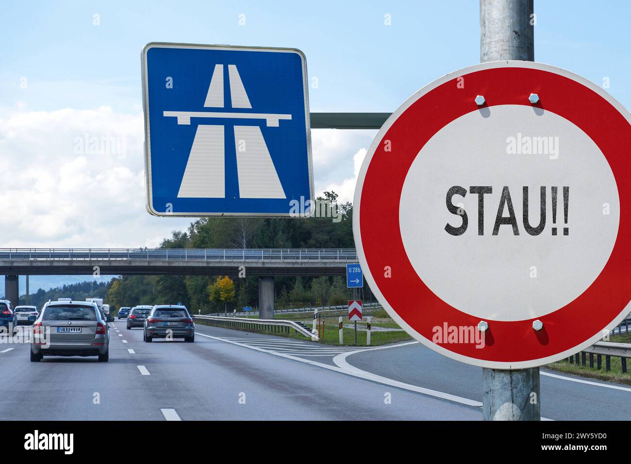 4 April 2024: Warning sign for traffic jam on the highway. PHOTOMONTAGE ...