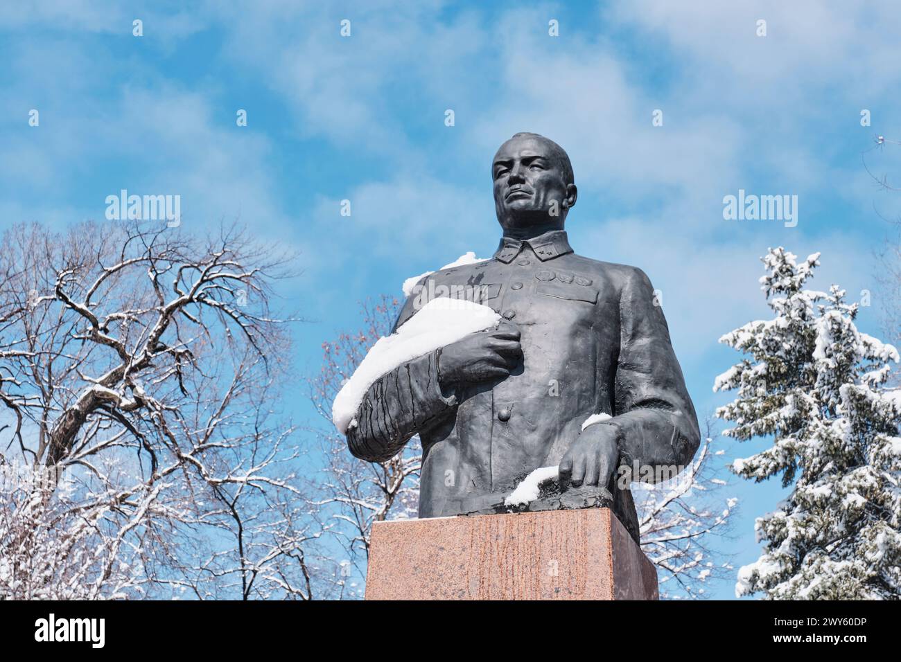 Closeup of monument-bust to the Soviet commander Panfilov in snow ...