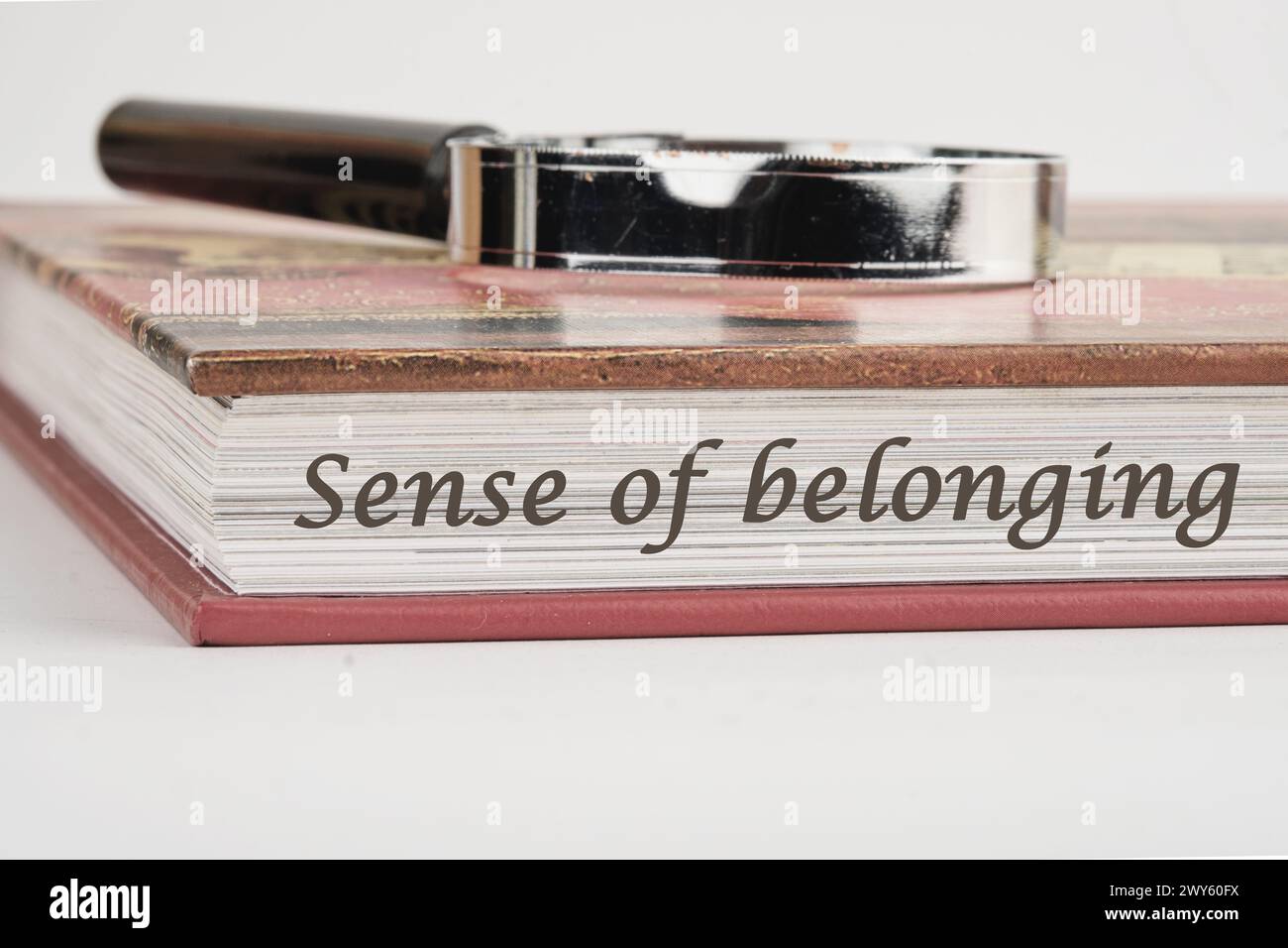 Business, sense of belonging concept. Text Sense of belonging on a book ...