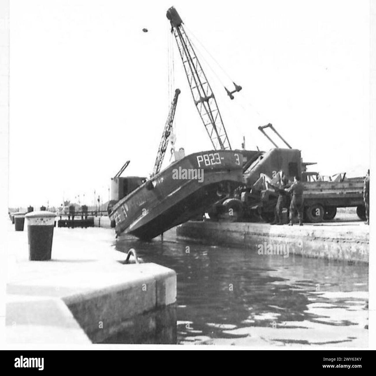 PREPARATIONS OF "U" FORCE - Photograph of crane lifting craft from lock ...