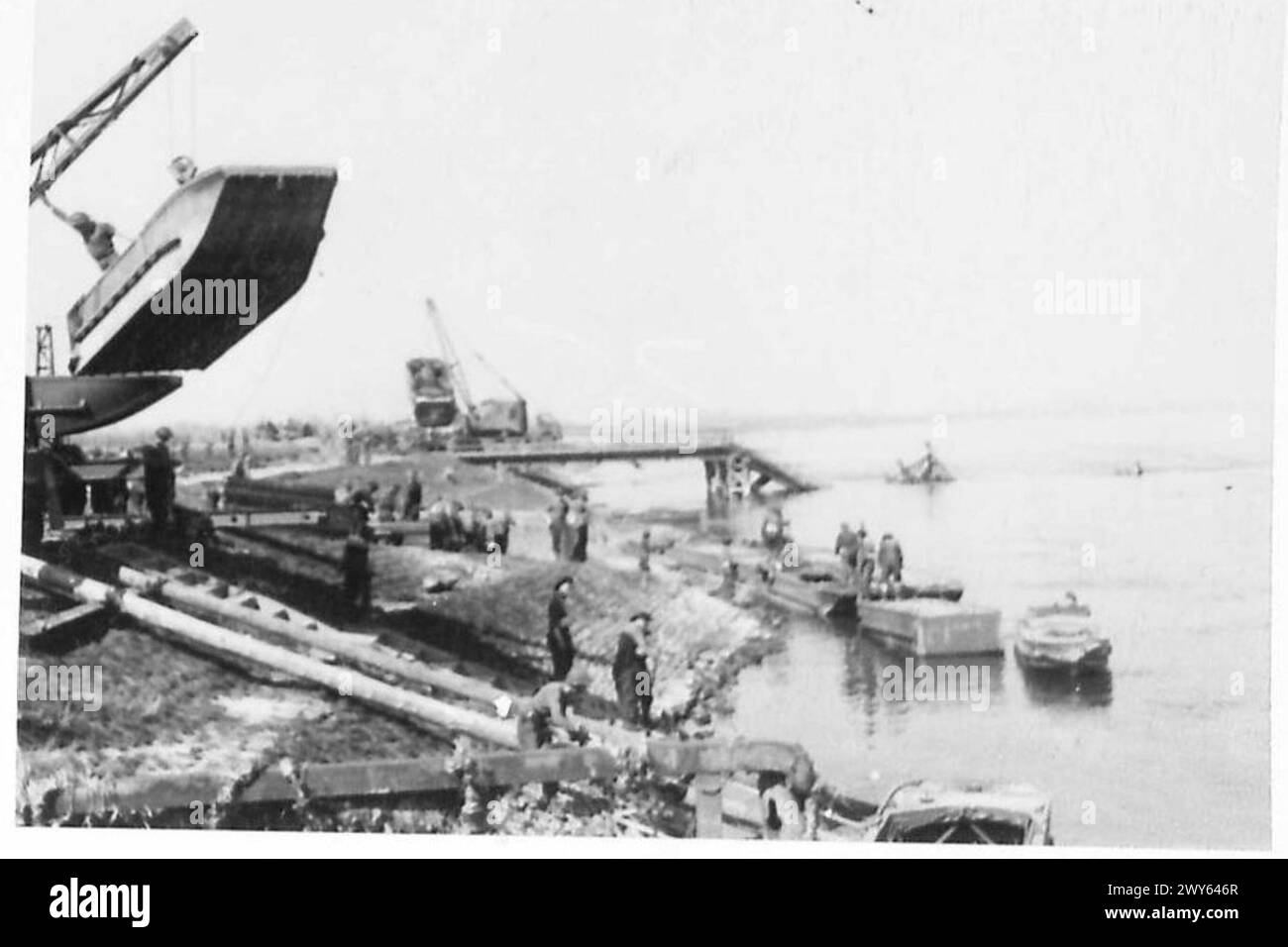 RHINE CROSSING - The pontoons are slid into the water for the bridging ...