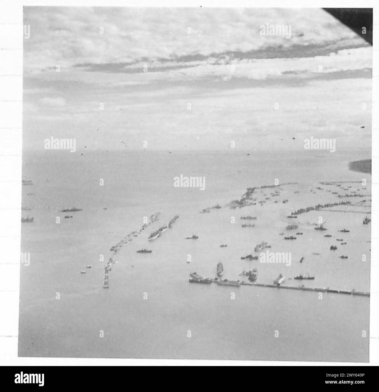 Aerial photographs show Mulberry B at Arromanches, a temporary harbor ...