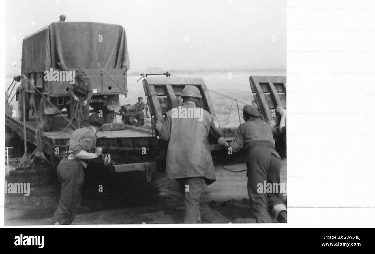 CROSSING OF THE RHINE - A lorry aboard one of the rafts being pushed ...