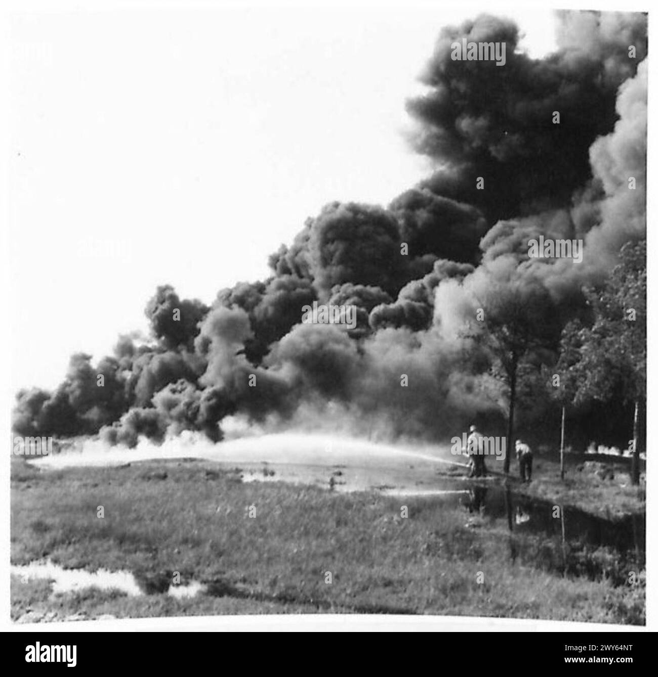 German firemen combat a fuel oil fire at Shell Oil docks in Hamburg ...