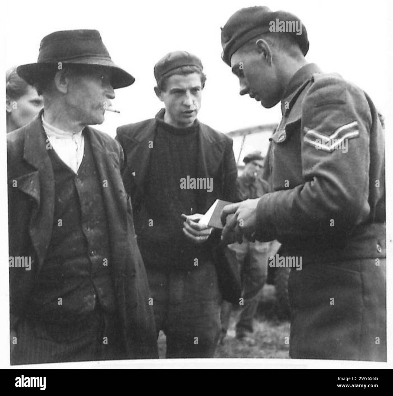 Intelligence Corps personnel of the British Army interviewed refugees ...