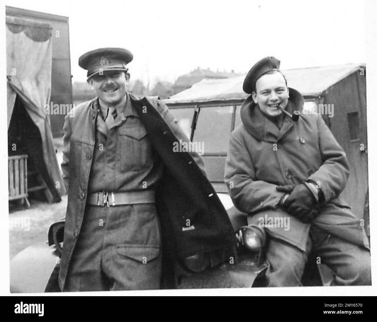 MOBILE LAUNDRY - Left to right Capt. Davis, O.C. 302 Mobile Laundry ...