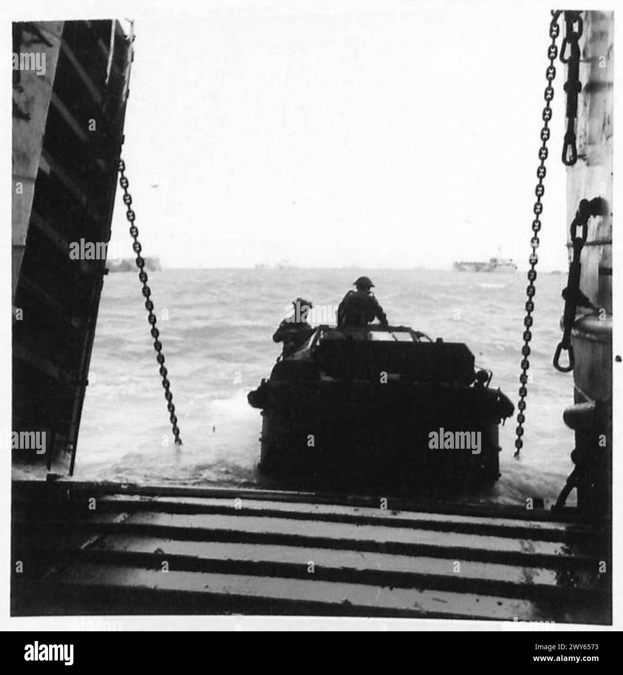 A DUKW amphibious vehicle carrying tank and self-propelled gun ...