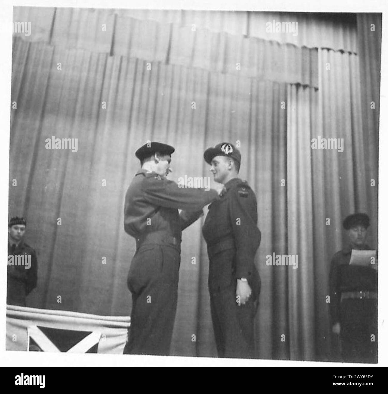 INVESTITURE 52nd (Lowland) Div. - Maj. S. Storm, 6 Cameronians receives ...