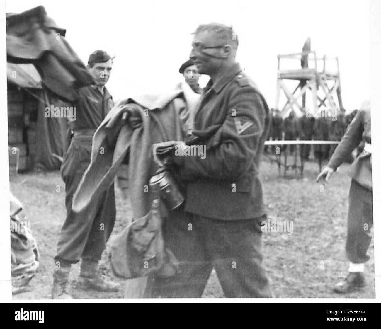 A soldier of the British Army in North-West Europe is issued a clean ...