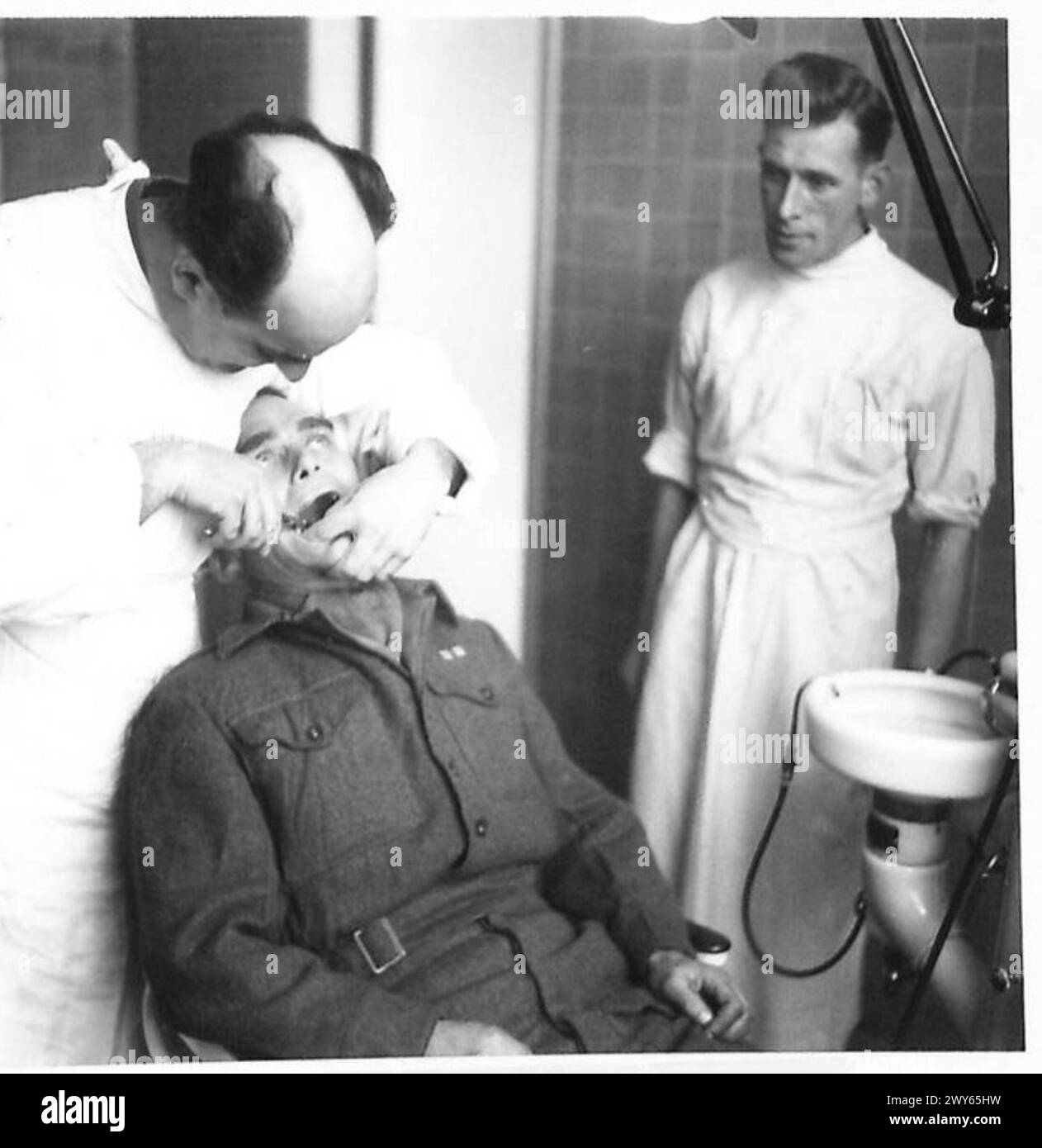 The extraction of tooth Black and White Stock Photos & Images - Alamy