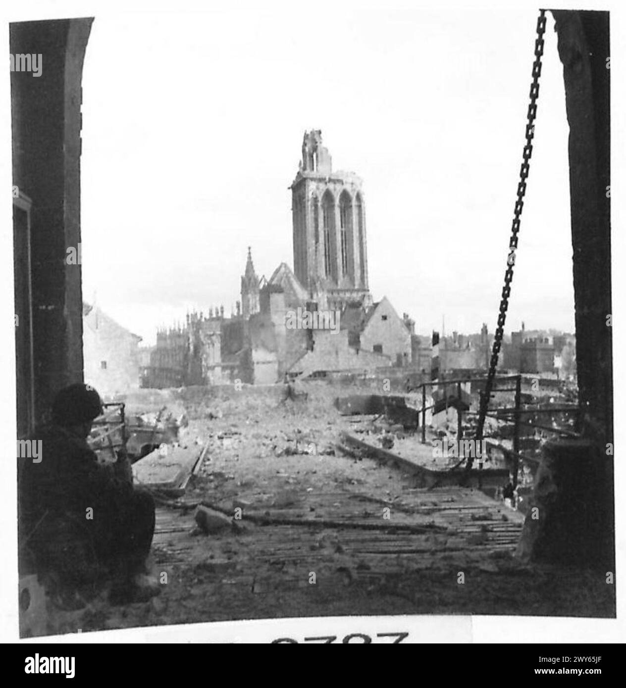 THE ENTRY INTO CAEN - A view of Caen showing smashed top of steeple ...
