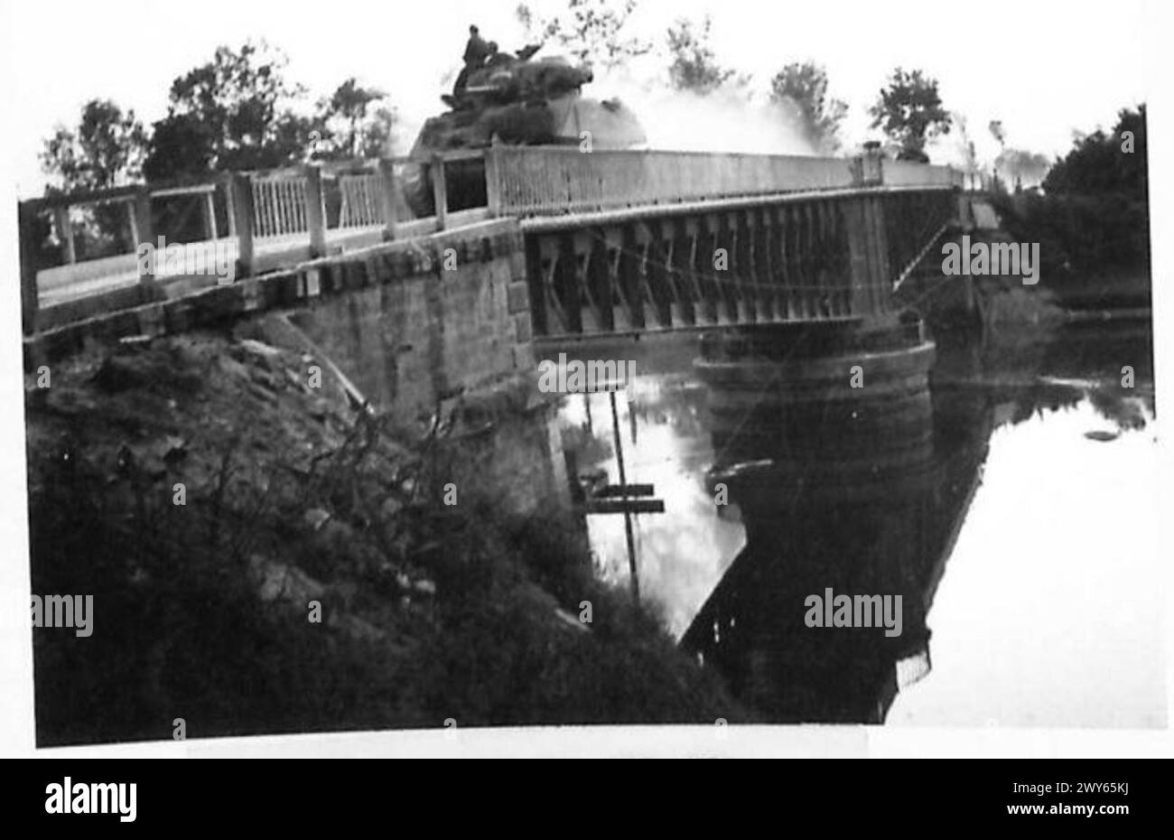 OUR ARMOUR CROSSES THE ORNE BRIDGE - Tanks crossing the river Orne by ...