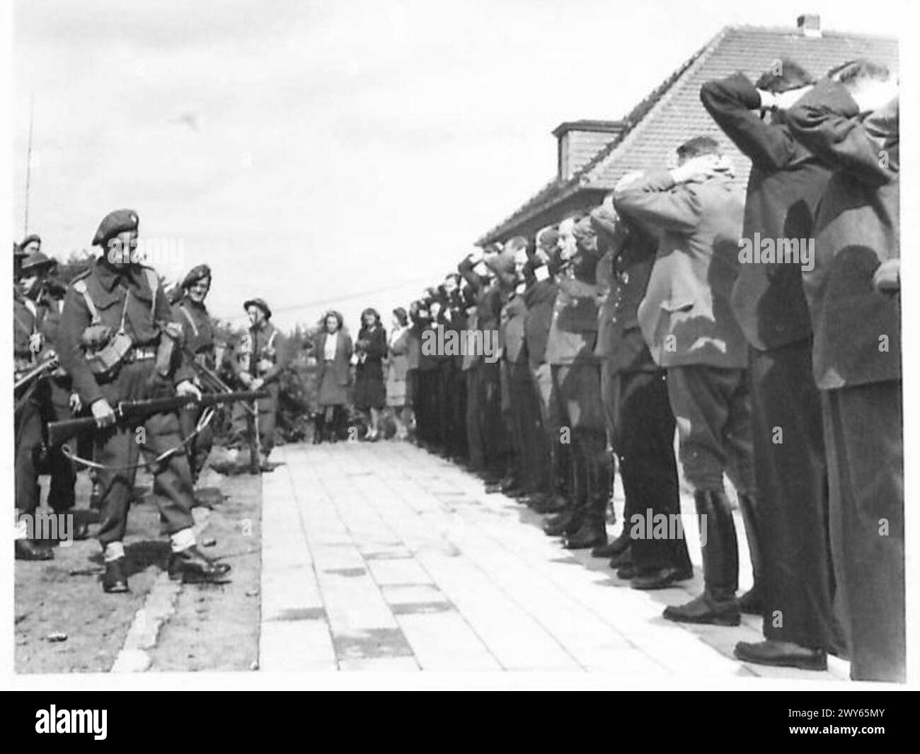 German government officials are lined up outside a building following ...