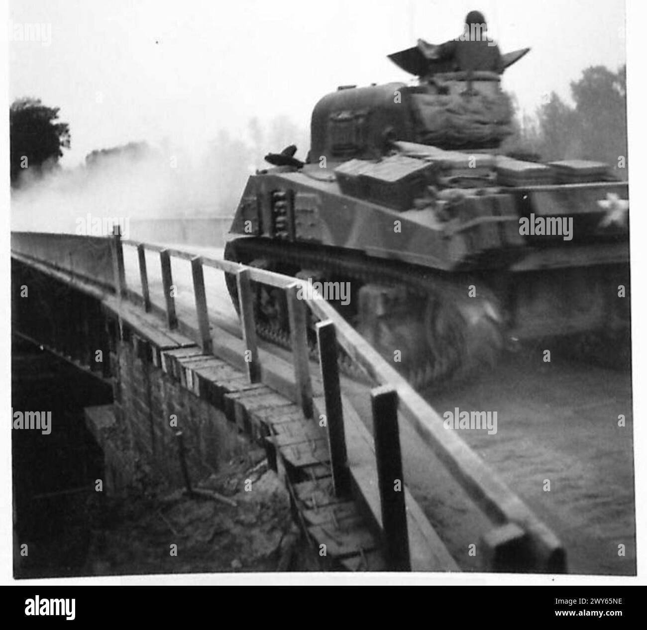 OUR ARMOUR CROSSES THE ORNE BRIDGE - A tank crossing the bridge at ...