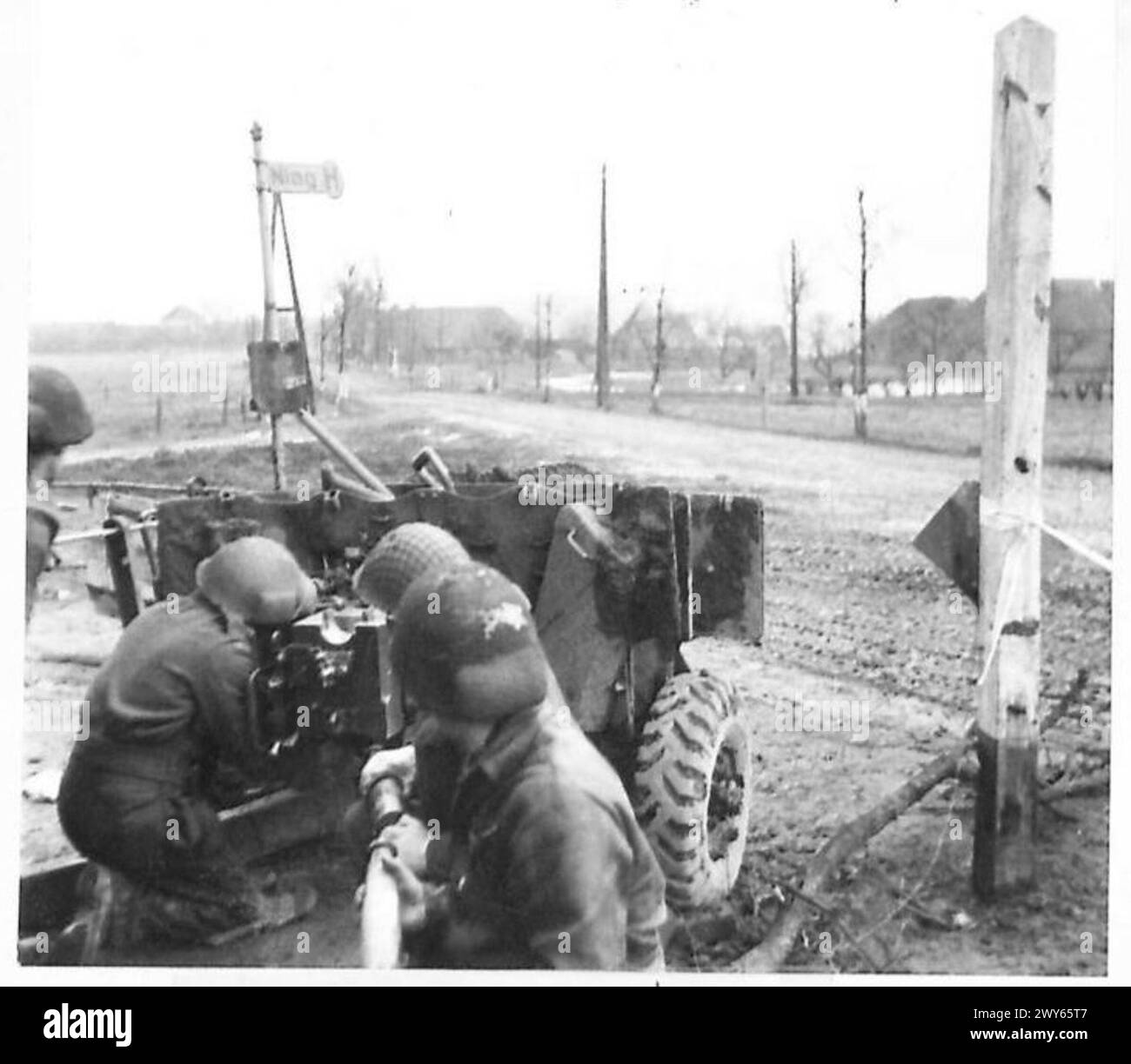 MISCELLANEOUS - Infantry mann anti-tank gun rear burning farmhouse near ...