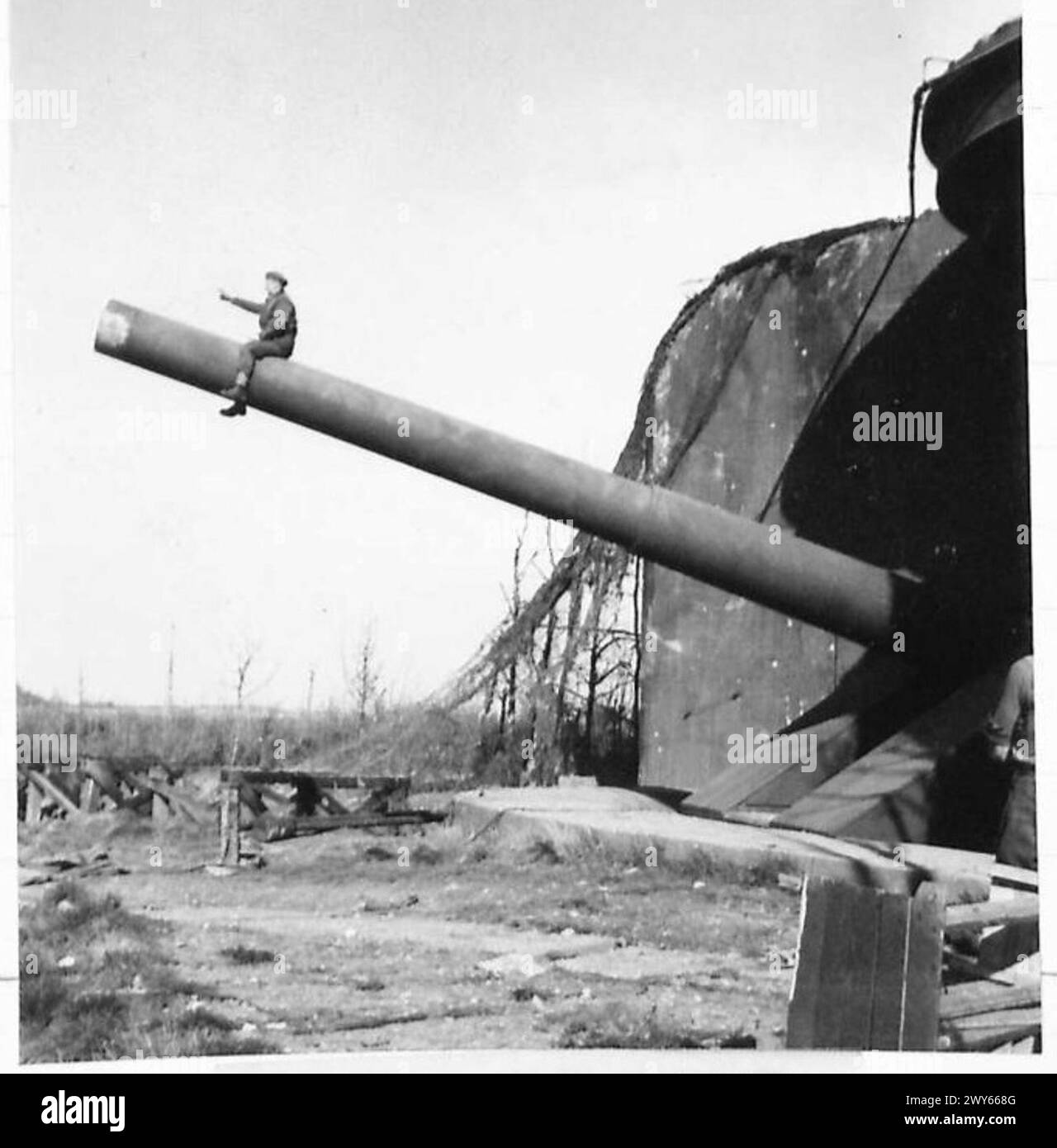 GERMAN CROSS-CHANNEL GUNS. - This soldier wanted a better view of the ...