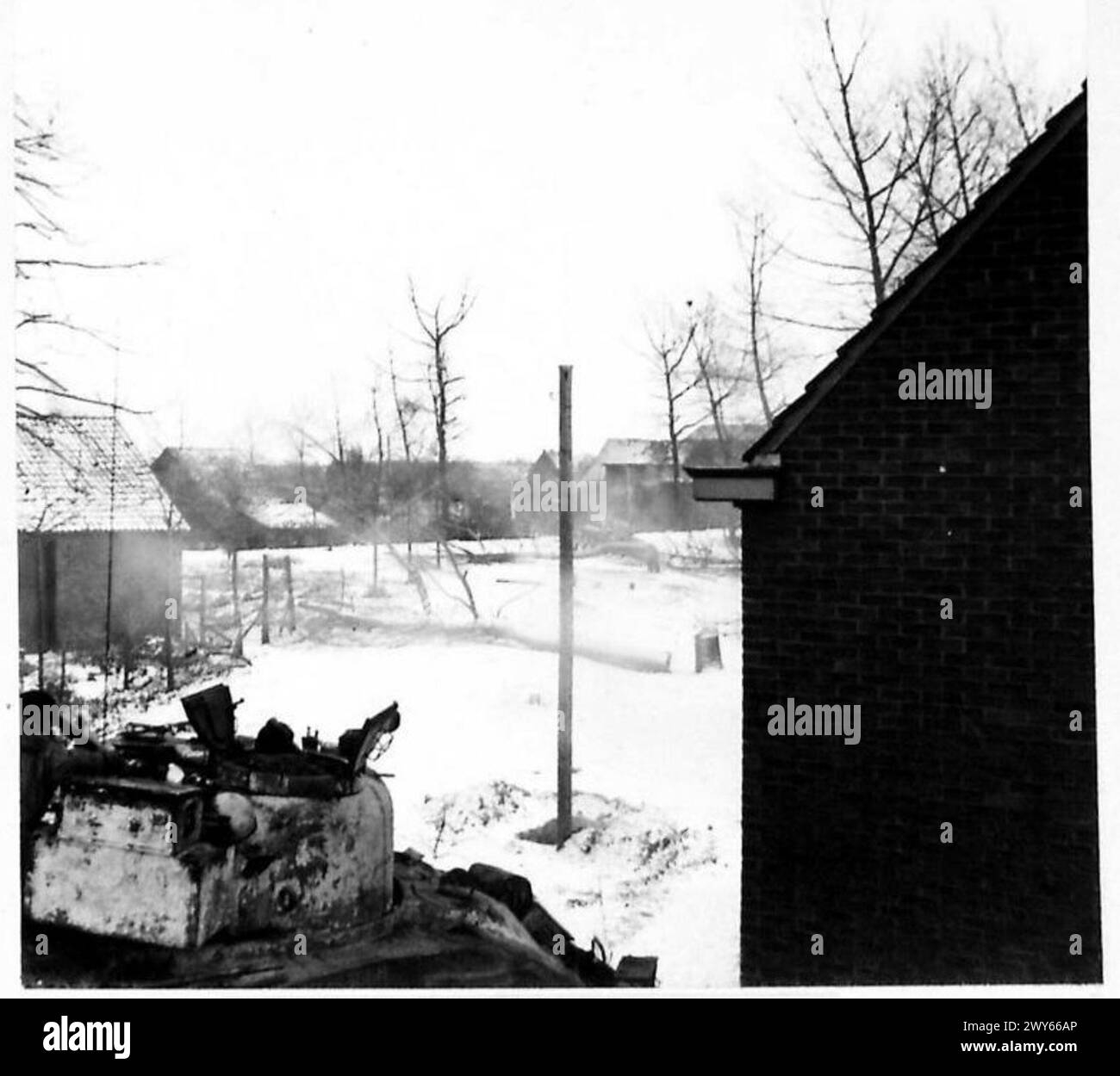 12 CORPS ADVANCE - Tank firing at machine gun nest on the outskirts of ...