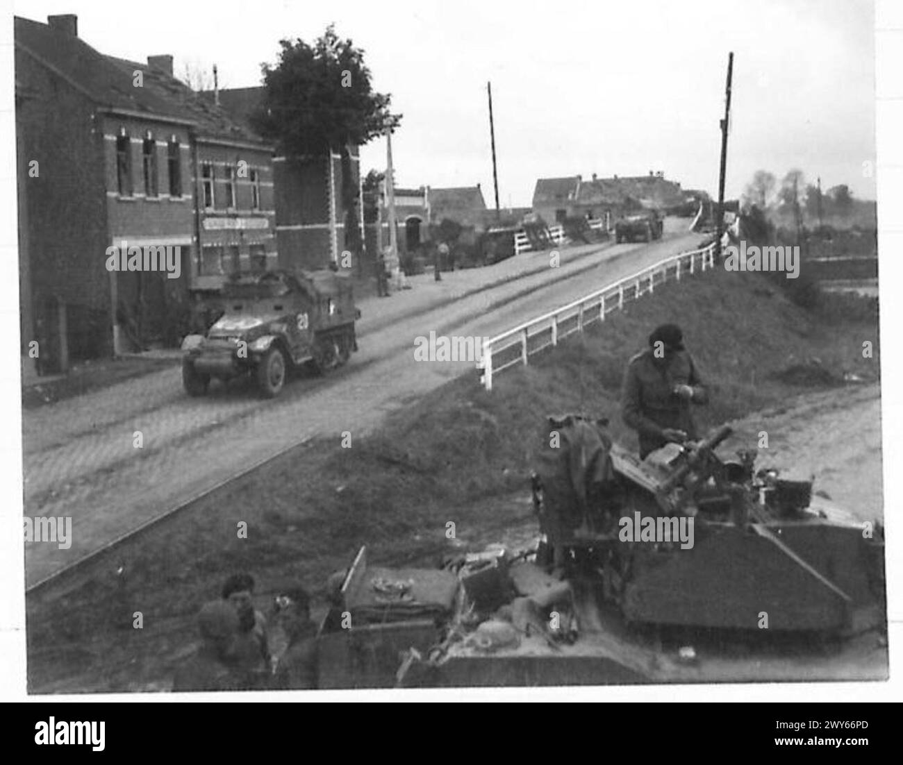 CROSSING THE ALBERT CANAL - Tanks and transport crossing the bridge ...