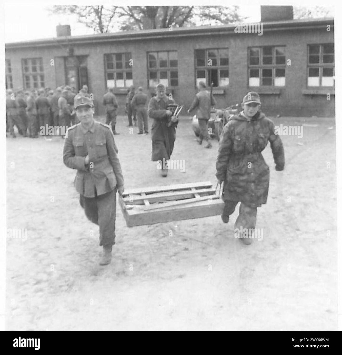 German troops move rifles and ammunition into barrack stores during the ...