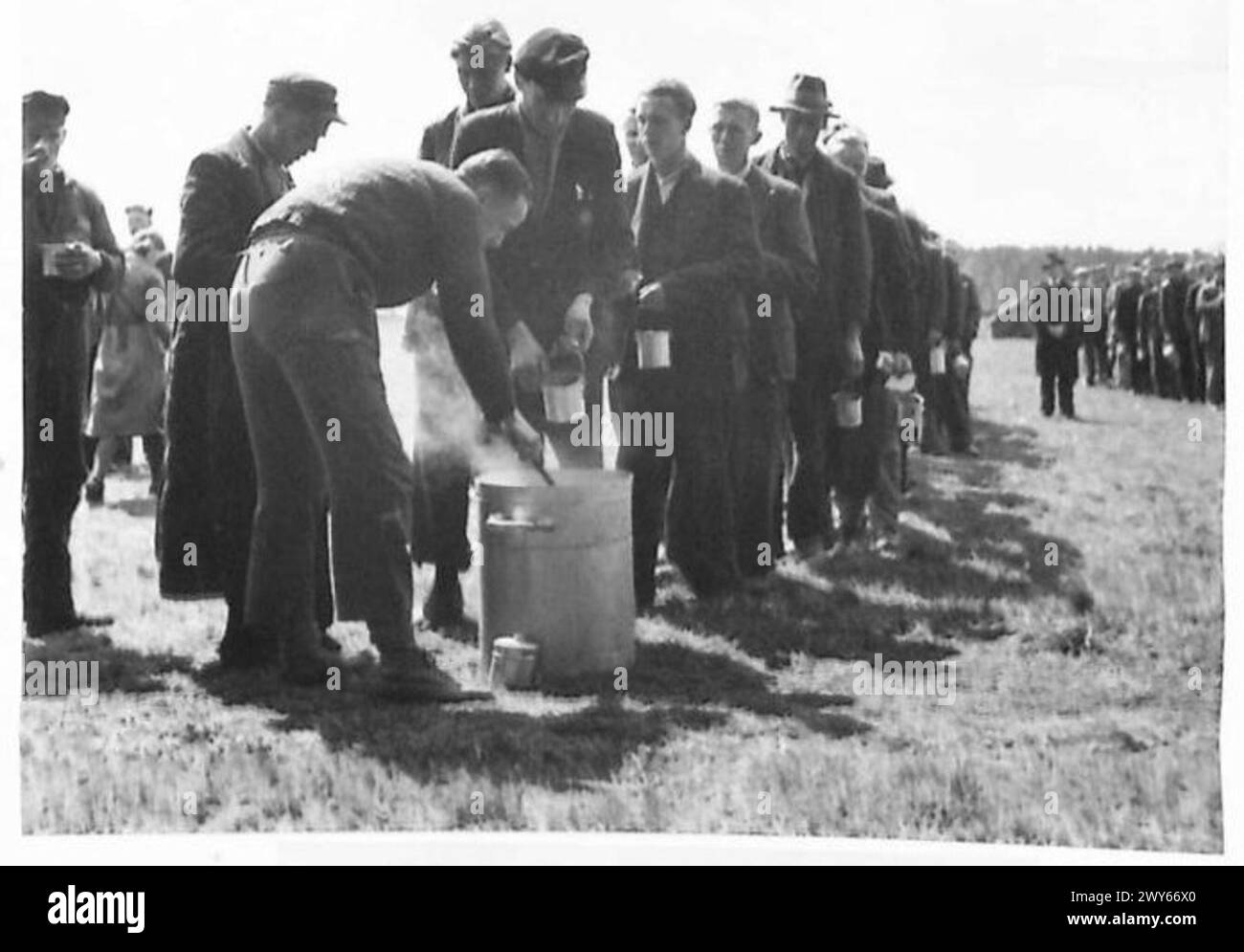 THE MAN FROM BREMEN - Gustaaf in food queues in the camp. , British ...