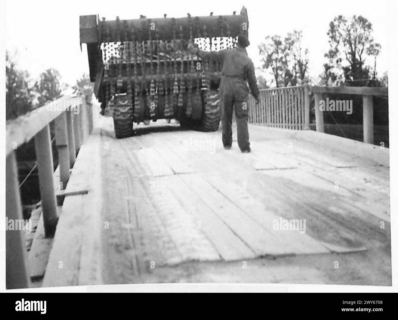 A Flail tank is carefully driven across the Orne Bridge, receiving ...