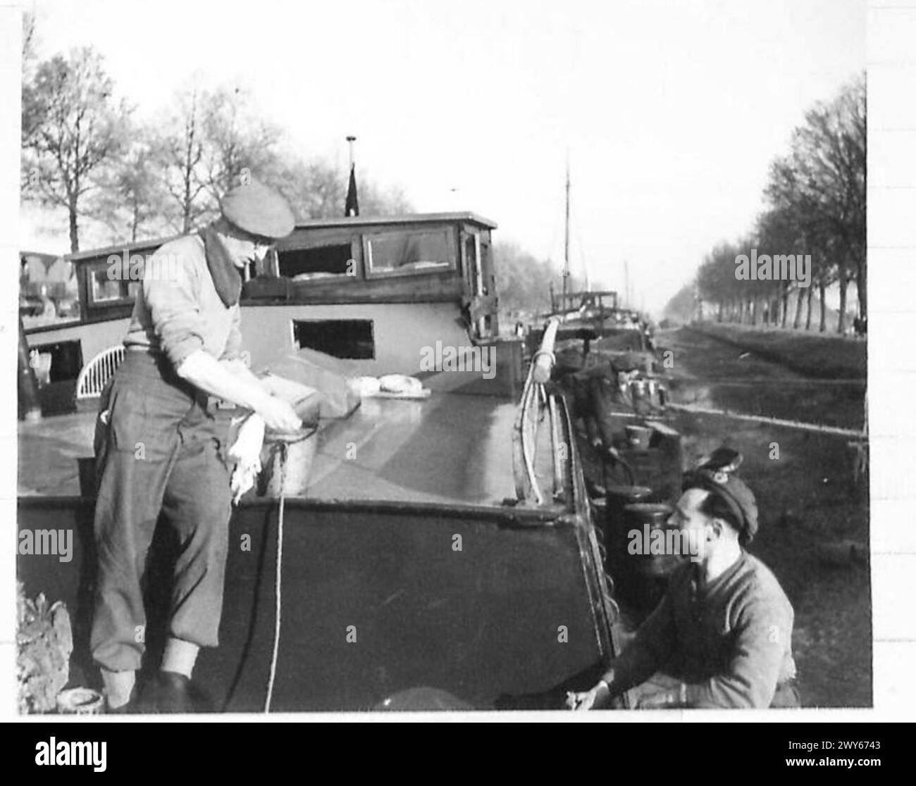 Spr. Selby of Bushley, Gloucestershire, is washing clothes aboard a ...