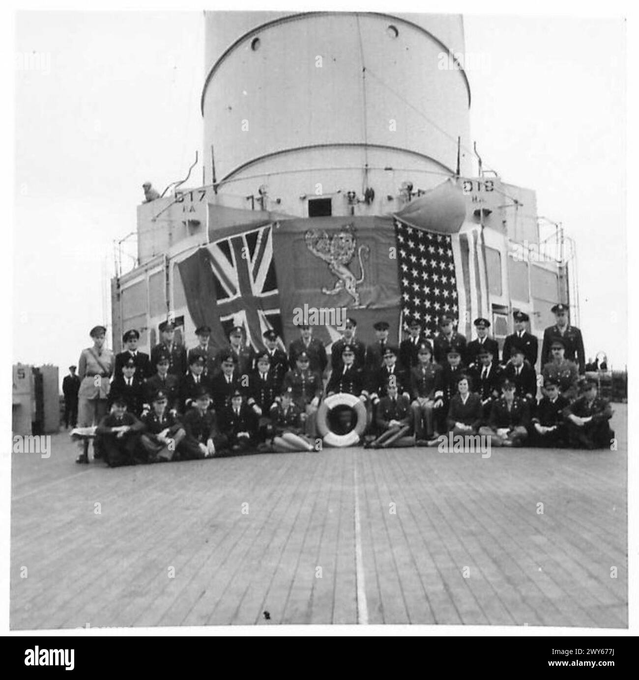 H.M.TROOPSHIP "QUEEN ELIZABETH" - A formal group of the ships staff ...