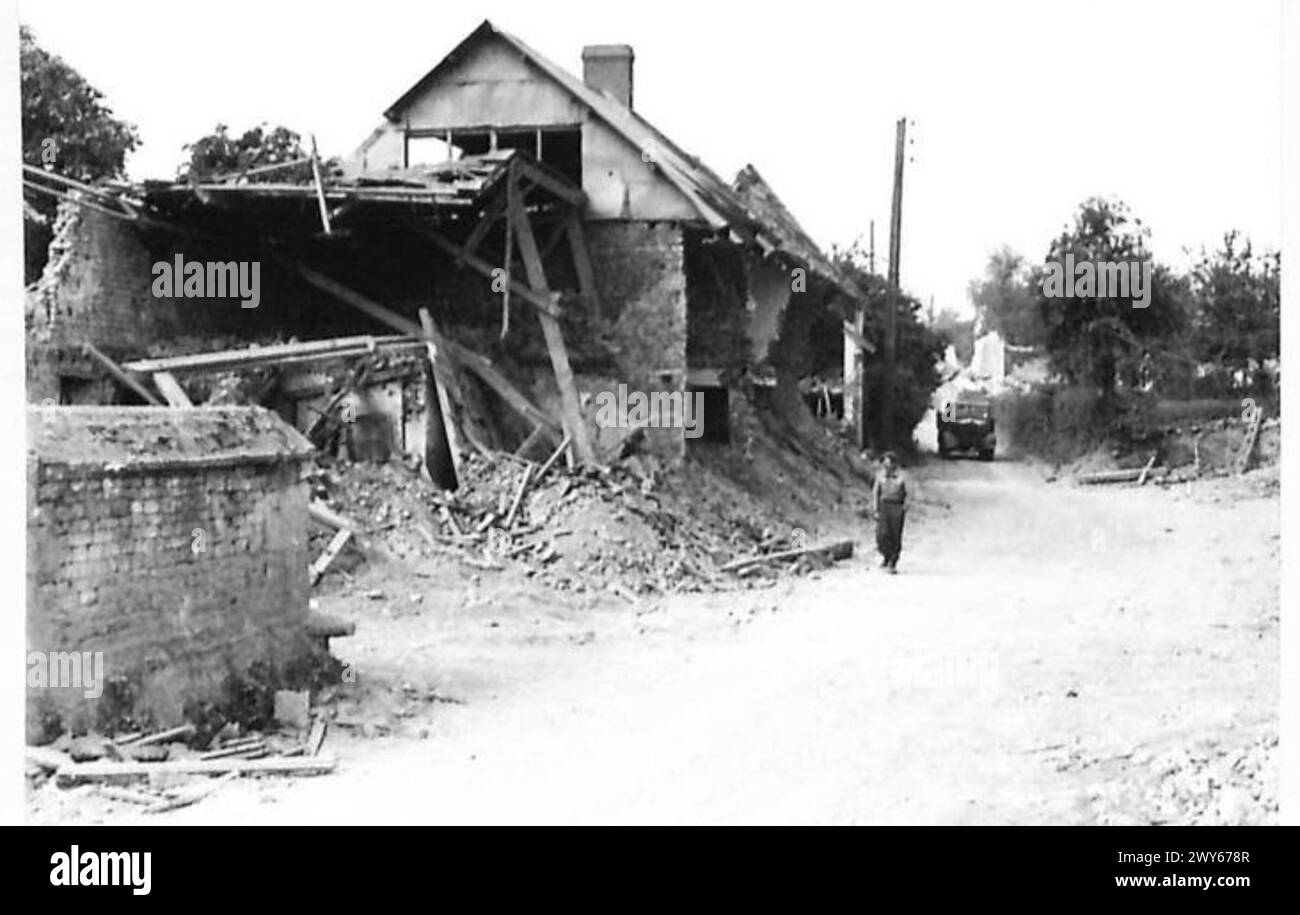 CLEARING A DEVASTATED FRENCH VILLAGE - A view of the devastated village ...