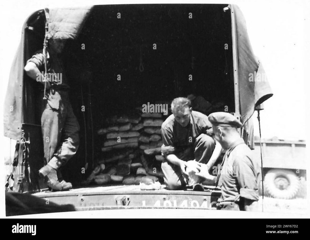 BREAD FOR BRITISH TROOPS IN NORMANDY - The supply officer inspecting ...
