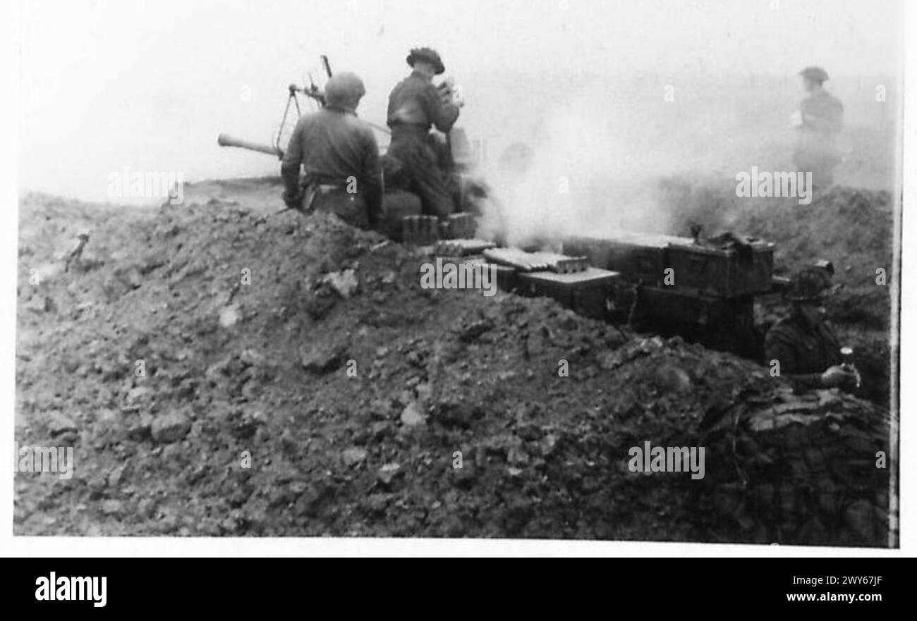 Bofor guns are deployed in action during the attack on Goch by infantry ...