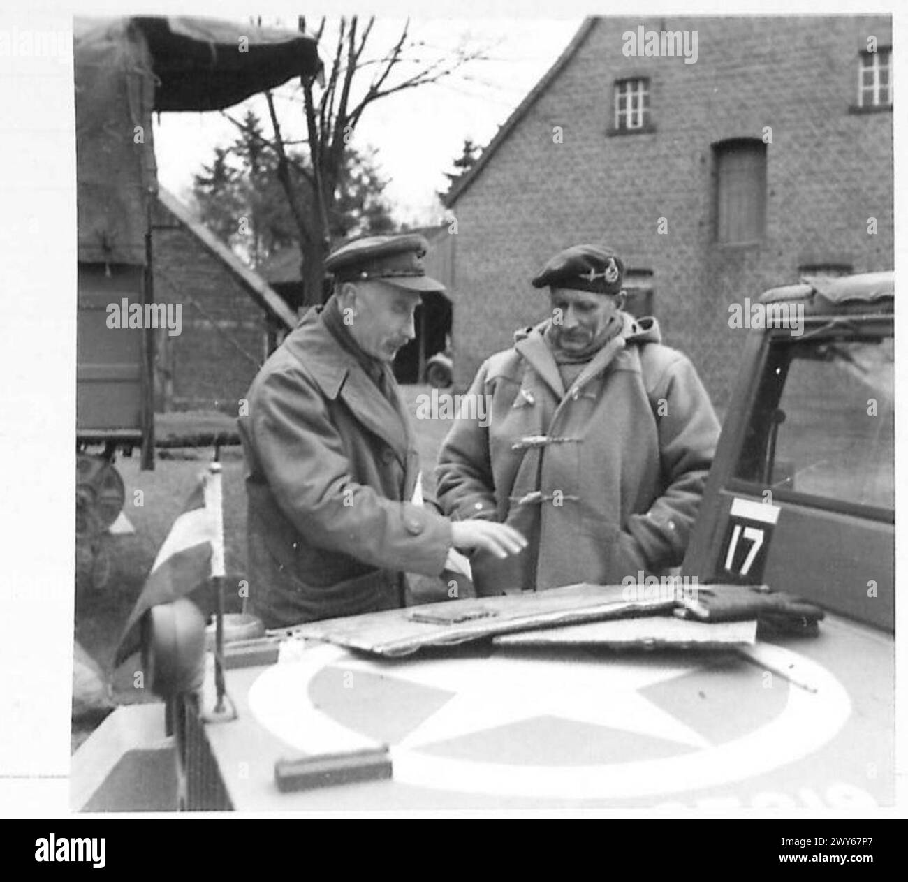 Field Marshal Montgomery reviews a map with Lieutenant General E.H ...