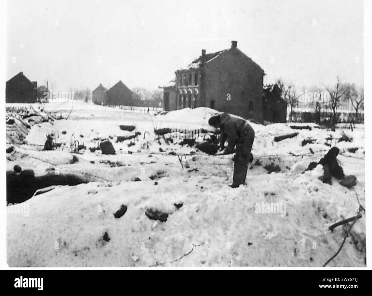Tankmen of the 12 Corps remove wire and boobytraps at a roadblock near ...