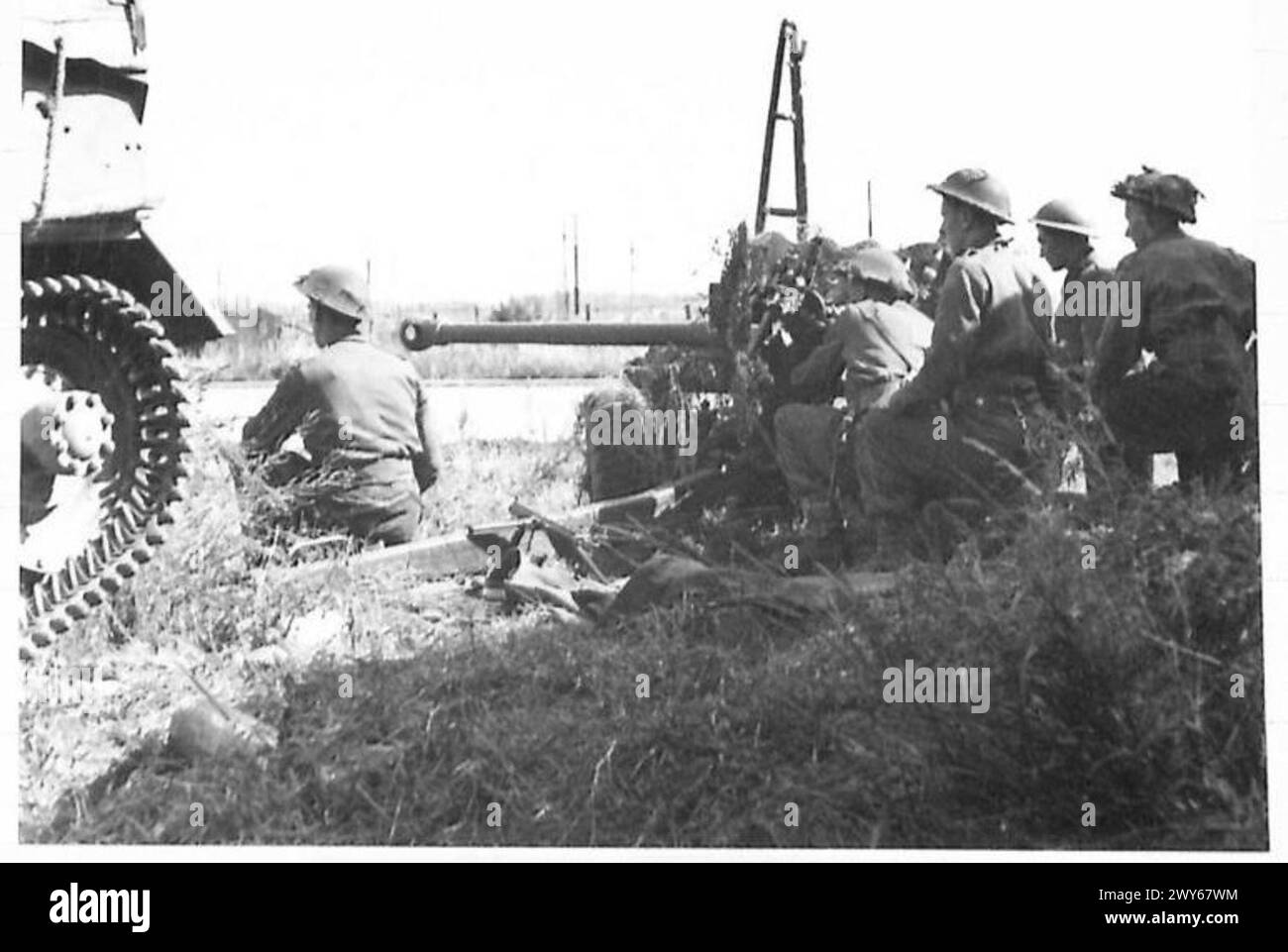 SCENES IN ANTWERP - Ready to repel tanks, a 6-pounder anti-tank gun in ...