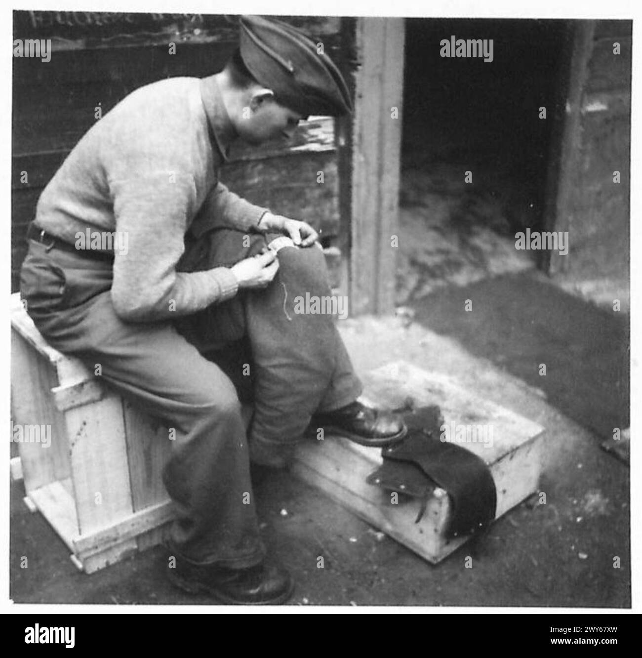 BRITISH UNIFORMS FOR FRENCH ARMY - A soldier sewing "France" flash on ...