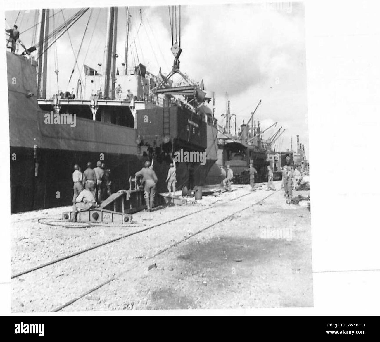 PHOTOGRAPHS OF PREFABRICATED PORT, ETC. - Loco tender being landed ...