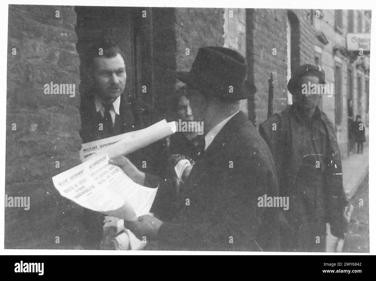 RHINE CROSSING - German civilians issued with a proclamation by the ...