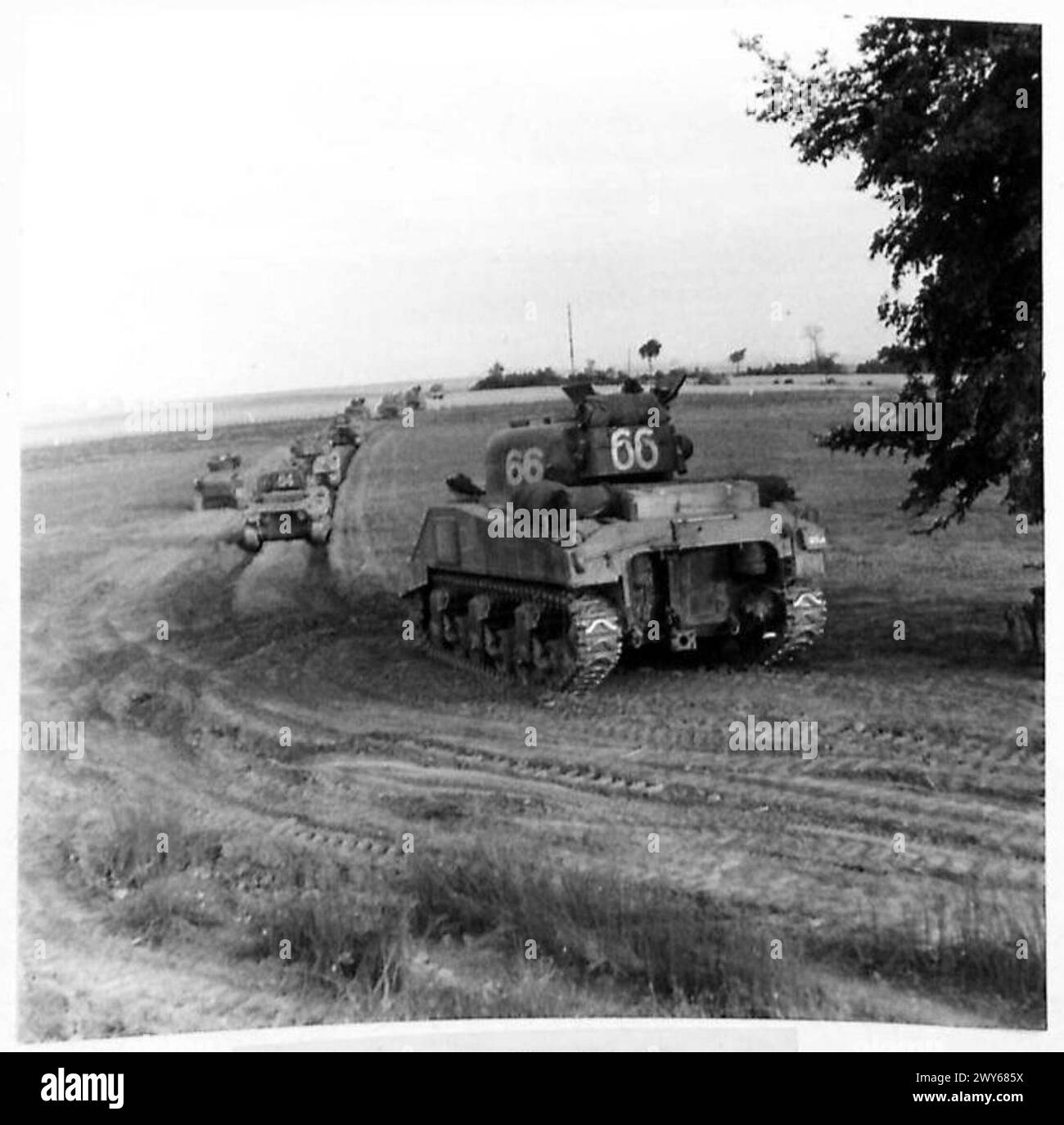 THE ATTACK ON CAEN - British Sherman tanks of A/T Brigade, 33rd Armoured Brigade passing through ...