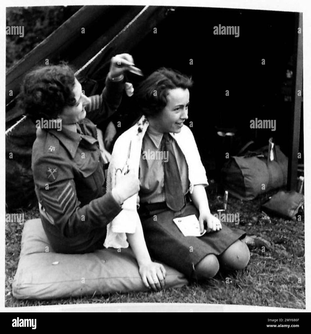 THE FIRST ATS IN NORMANDY - Sgt. Ruth Loe obliges Sgt. Kathleen Mundy ...
