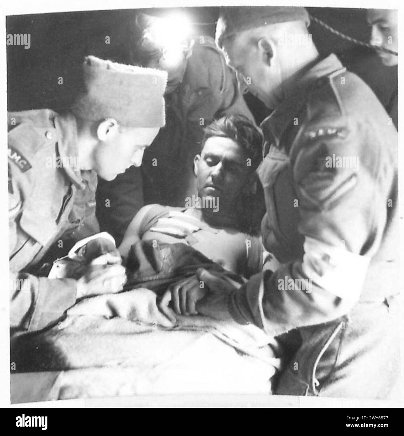 Wounded patients receive treatment and evacuation at a Field Dressing ...