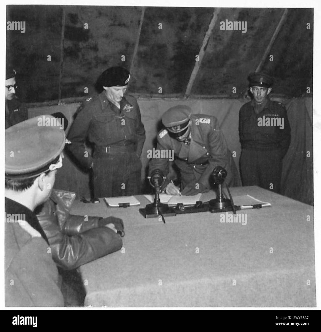 General Kinzel, Chief of Staff to Field Marshal Busch, signs the ...