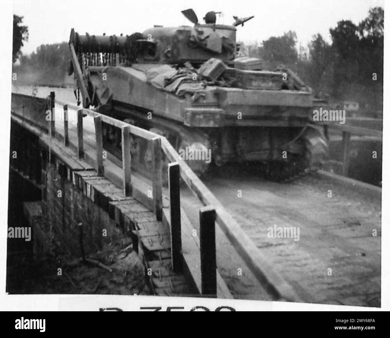OUR ARMOUR CROSSES THE ORNE BRIDGE - Over the bridge is seen going one ...