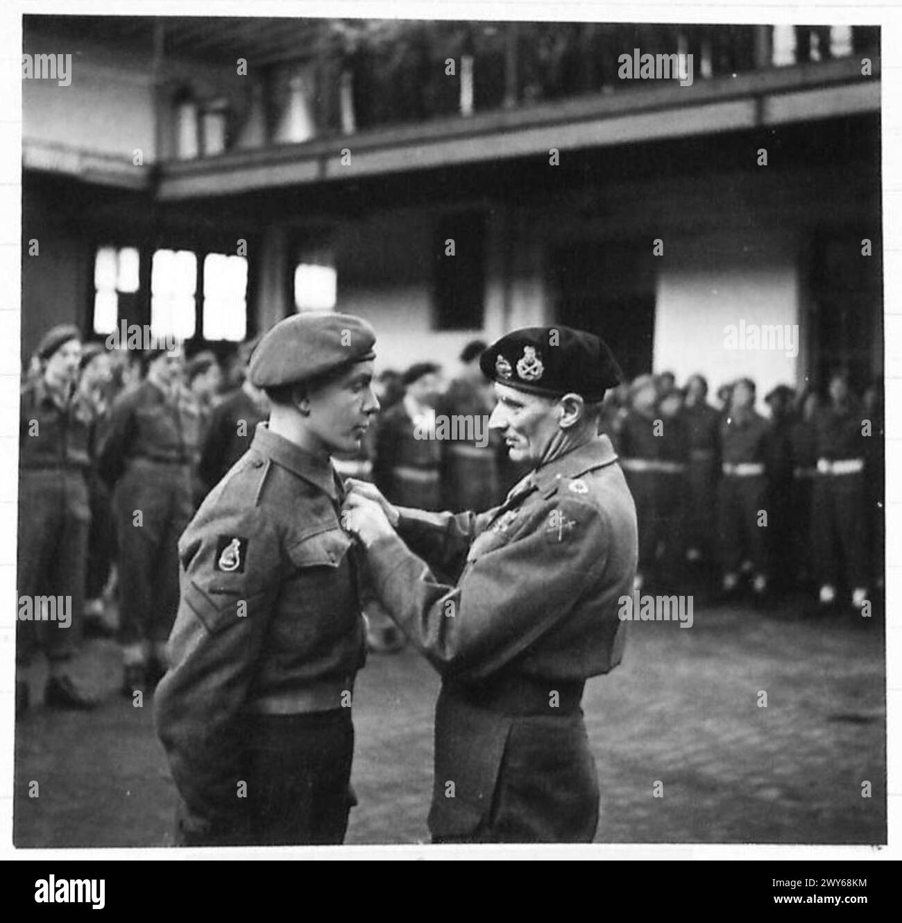"DESERT RATS" INVESTITURE - Cpl. E. Osborne, 1 RB receives the MM ...