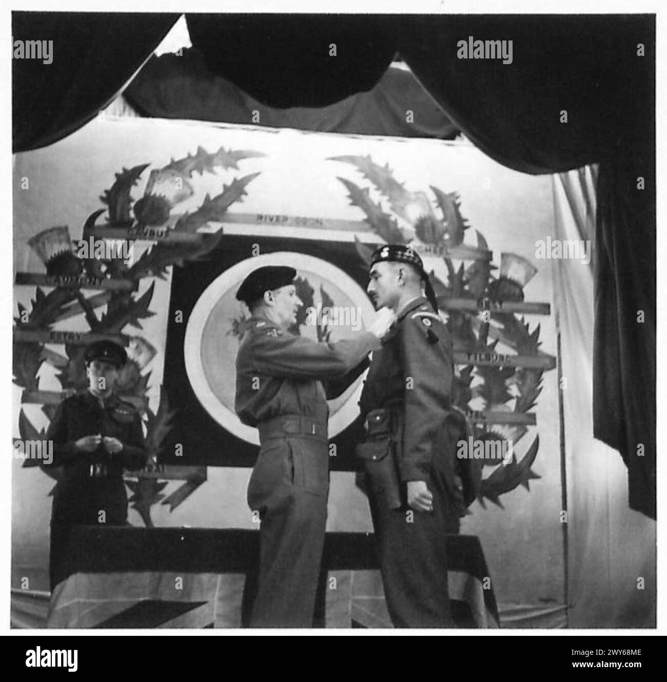 15TH (SCOTTISH) DIV. INVESTITURE - Maj. H.M. Gow, 6 RSF, receives the ...