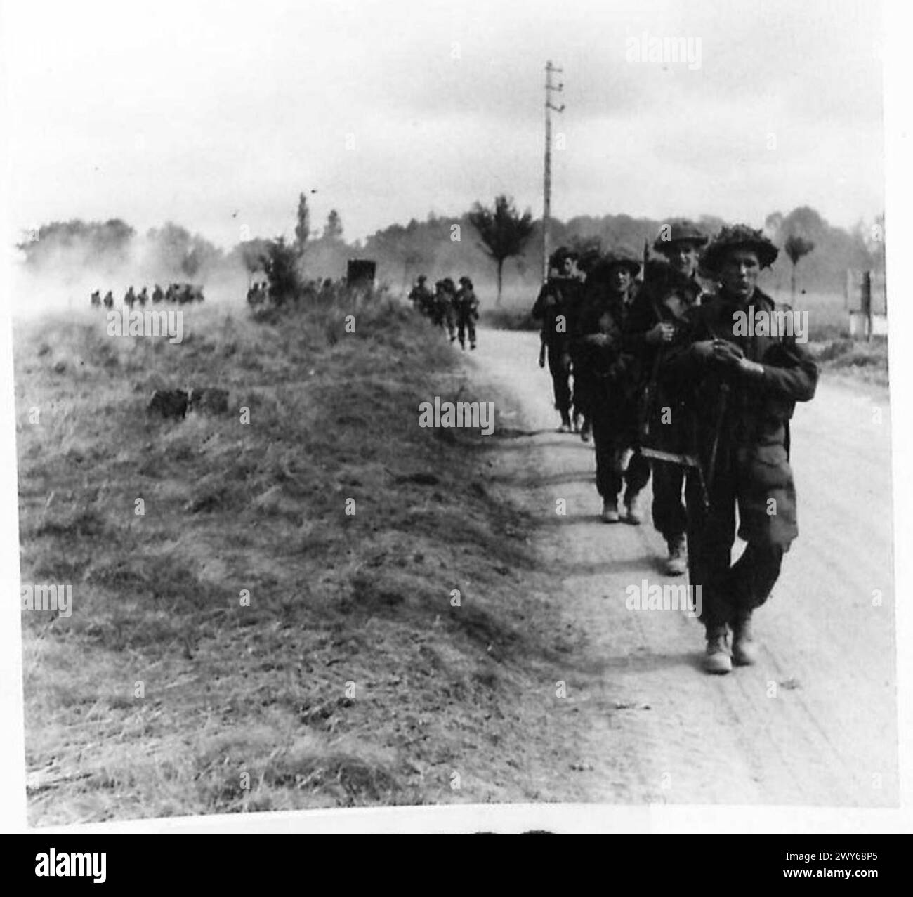 Royal Scots Fusiliers advance up the line on Hill 113 during a British ...