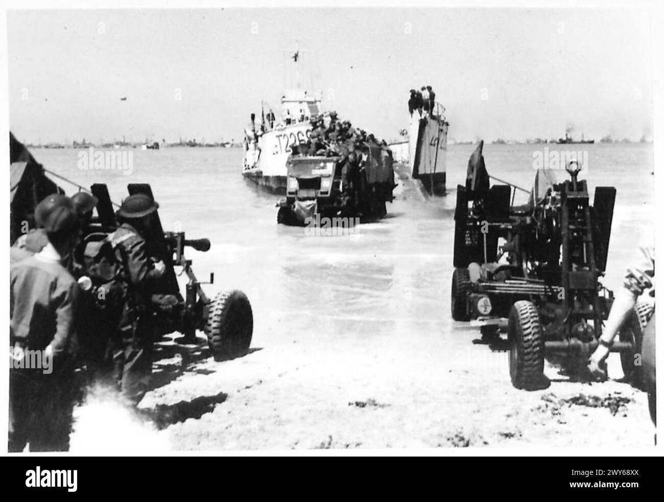 Men of the 51 Highland Division are driven off a Landing Craft Tank ...